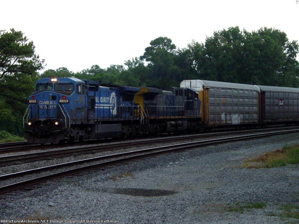 CSX C40-8W #7326, with the distinctive Conrail marker lights glowing, leading CSX autorack train ...